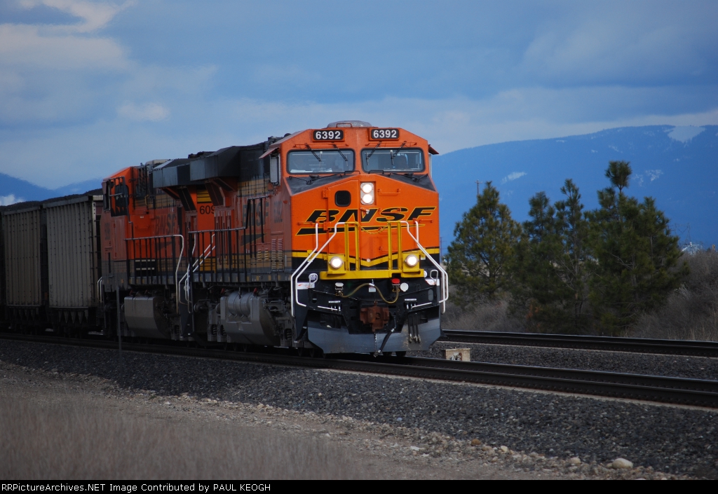 BNSF 6392 gets closer to me as she rolls west with a loaded coal.